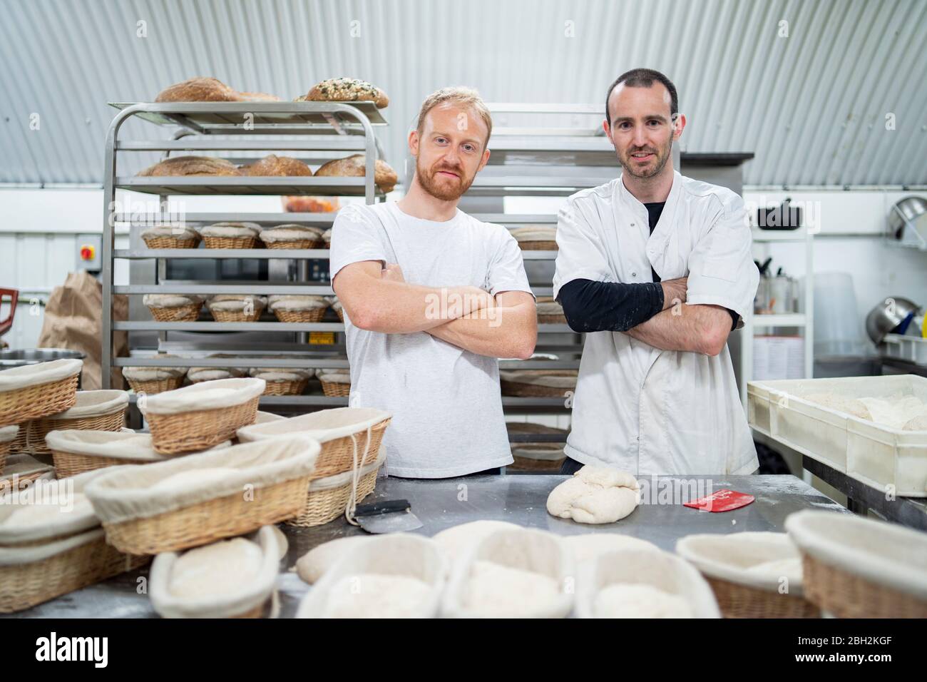 Portrait of two confident bakers in bakery Stock Photo - Alamy