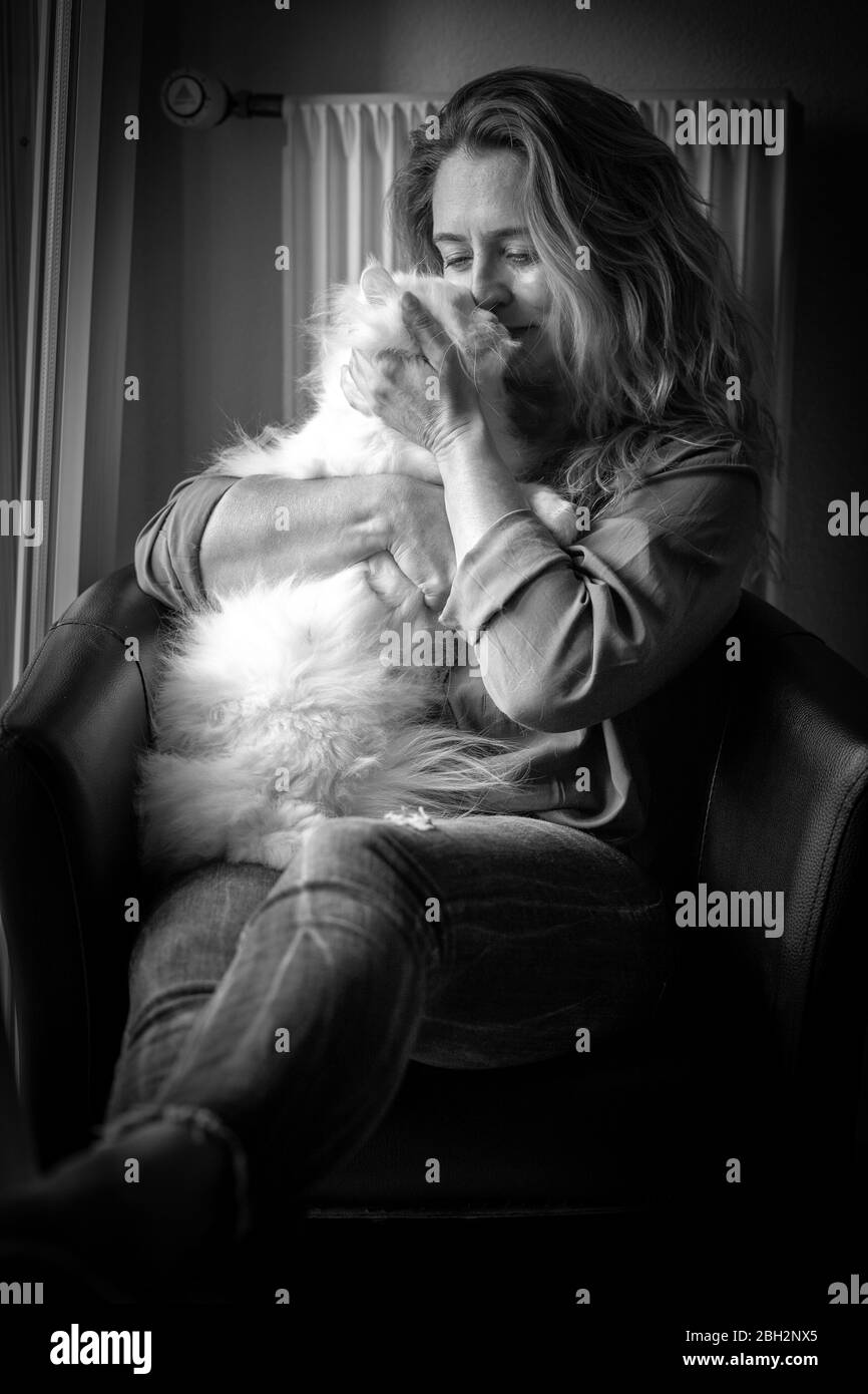 Young woman white cat Black and White Stock Photos & Images - Alamy