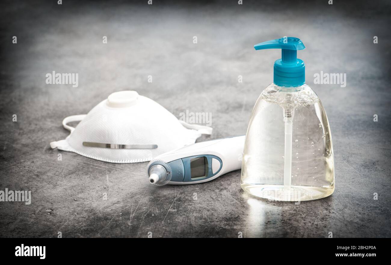 Virus prevention hygiene concept. Hand sanitizer, thermometer and ...