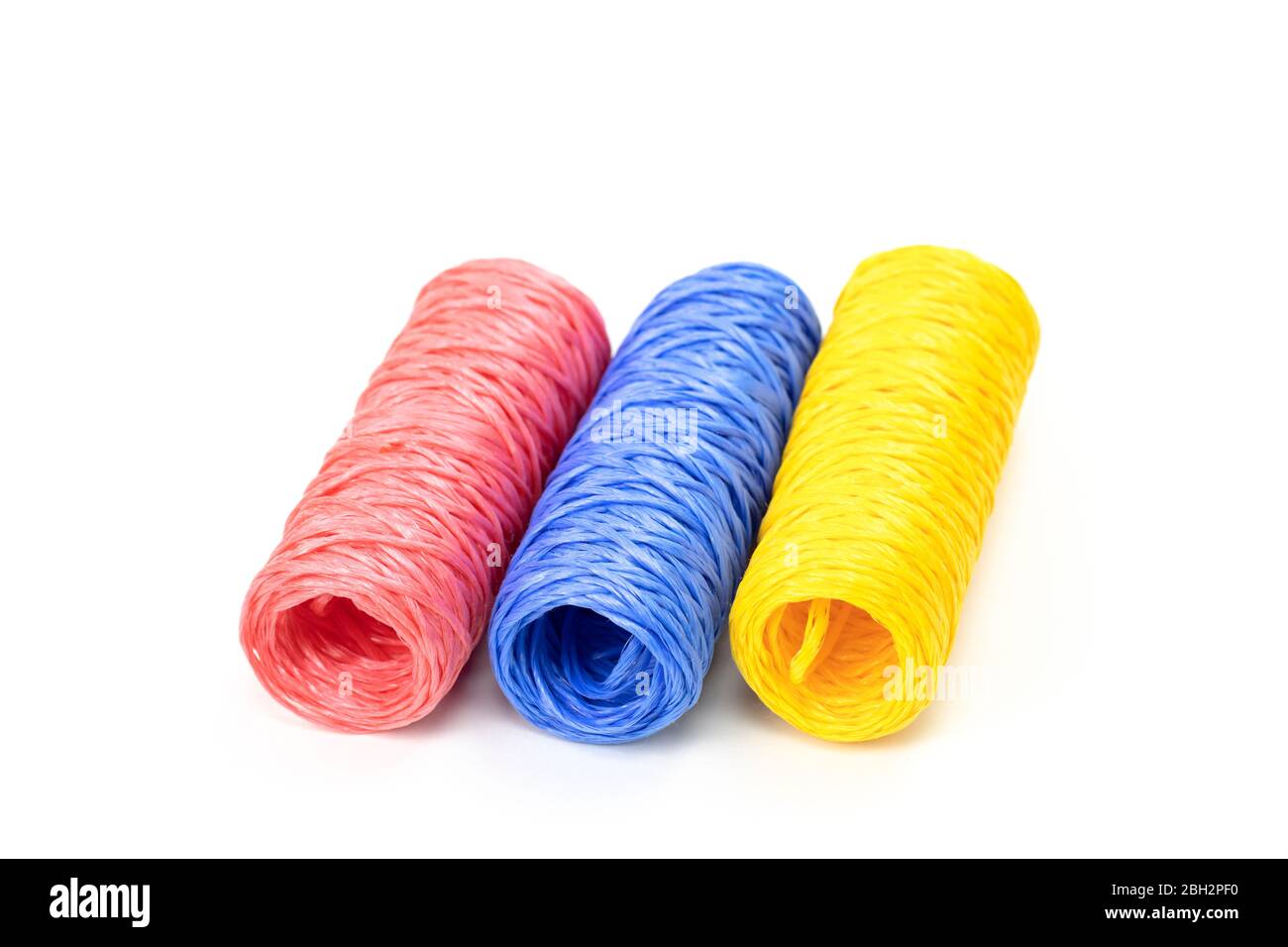 Hanks of colorful twine - pink, blue and yellow. concept of we're ...