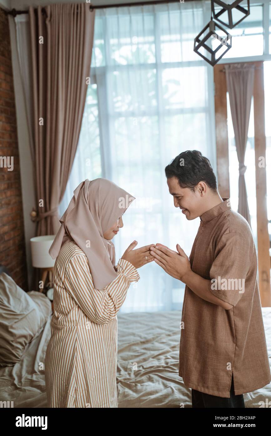 muslim man and woman asking for forgiveness during ramadan kareem. eid ...