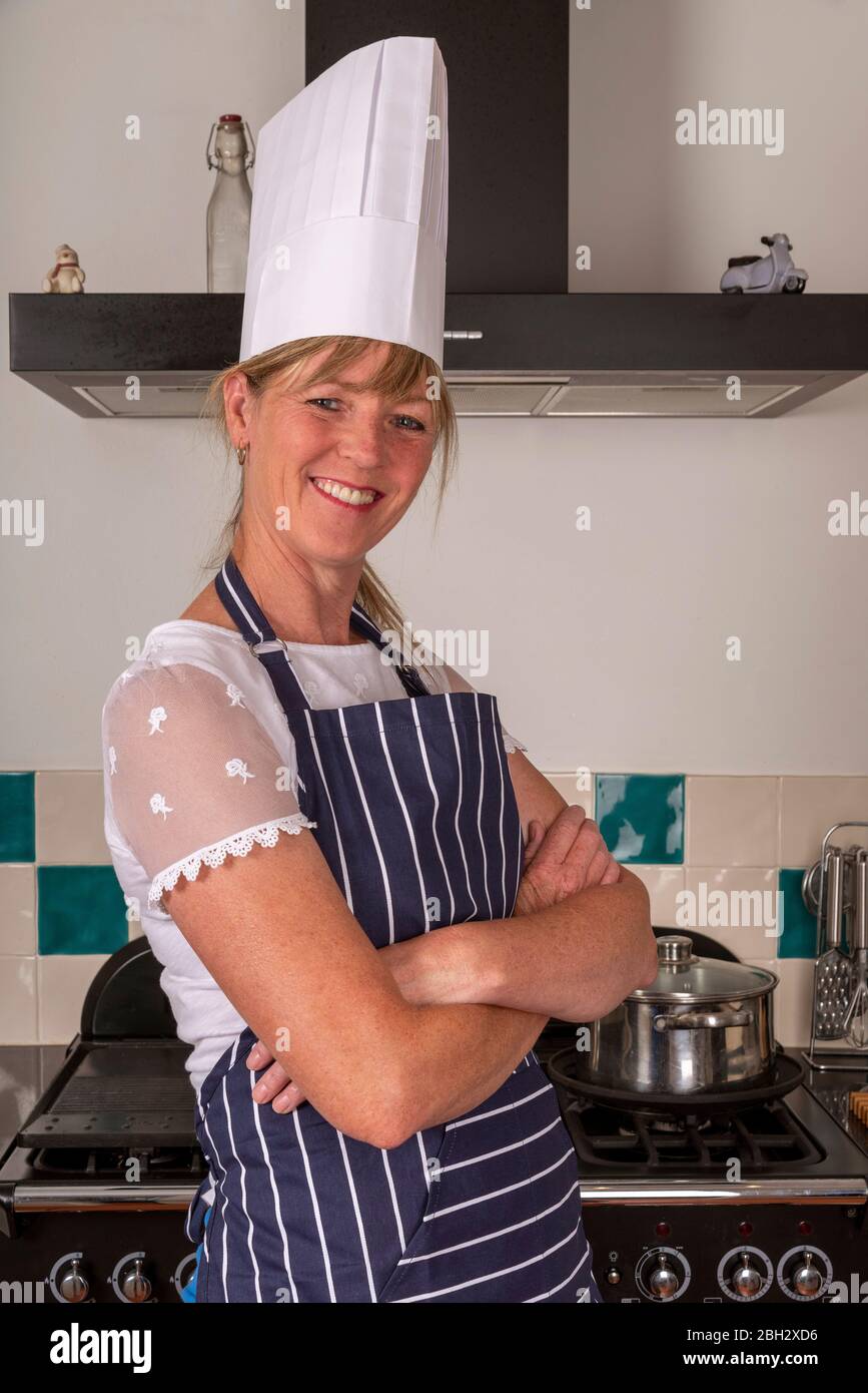 Blonde woman chef in apron hi-res stock photography and images - Alamy