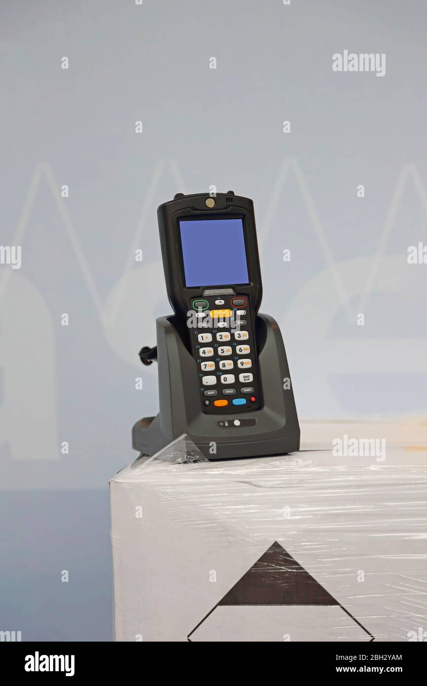 Handheld Barcode Reader and Scanner at Charger Dock Stock Photo - Alamy