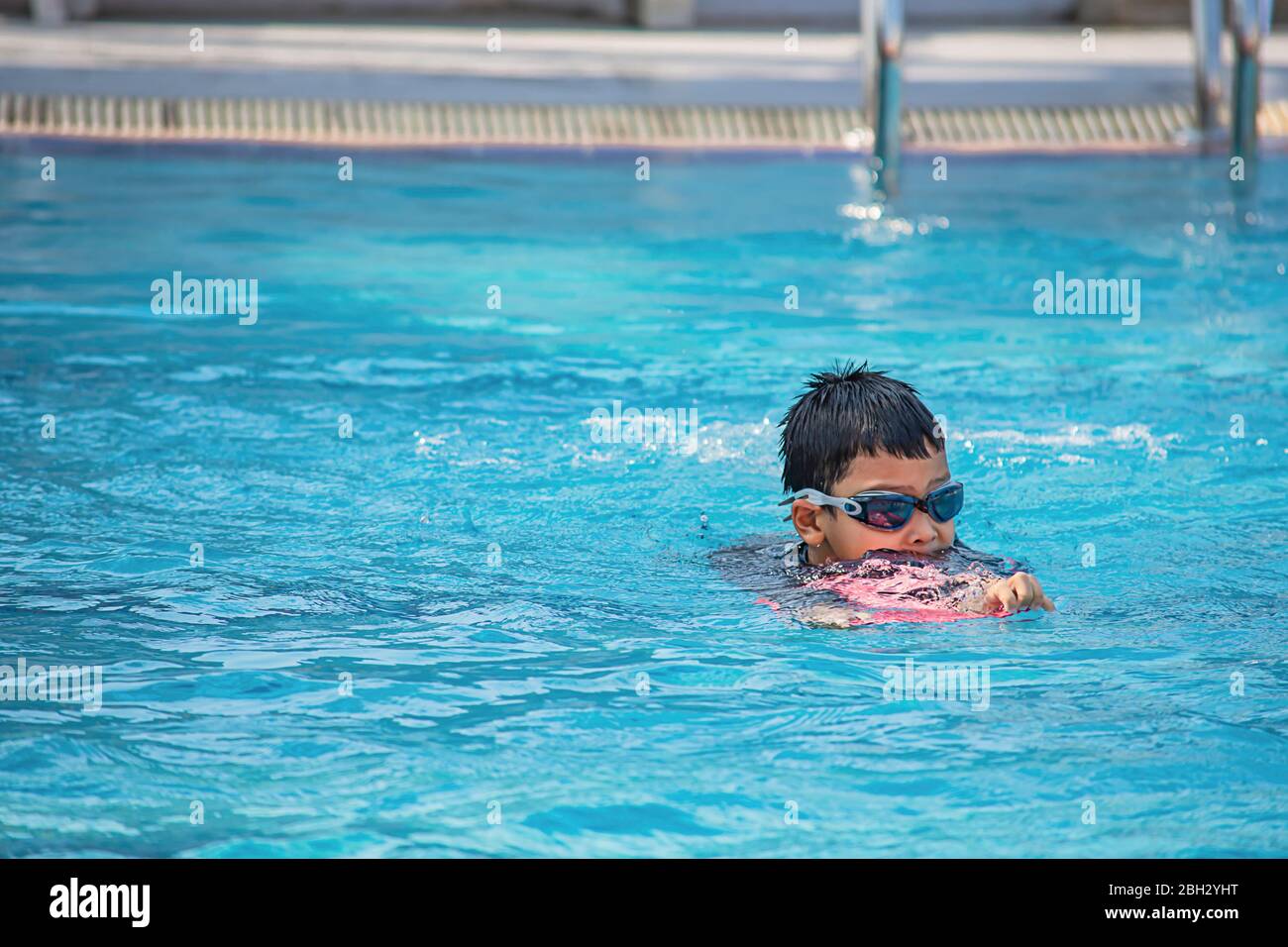 Asean boys are swimming in the pool Stock Photo - Alamy