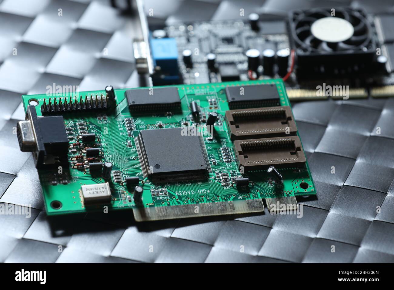 Old green computer chip and old video card on a grey table Stock Photo ...