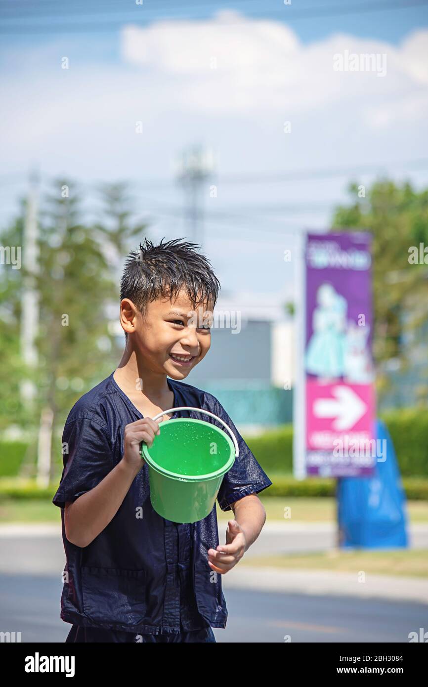 Boy water splash bucket hi-res stock photography and images - Alamy