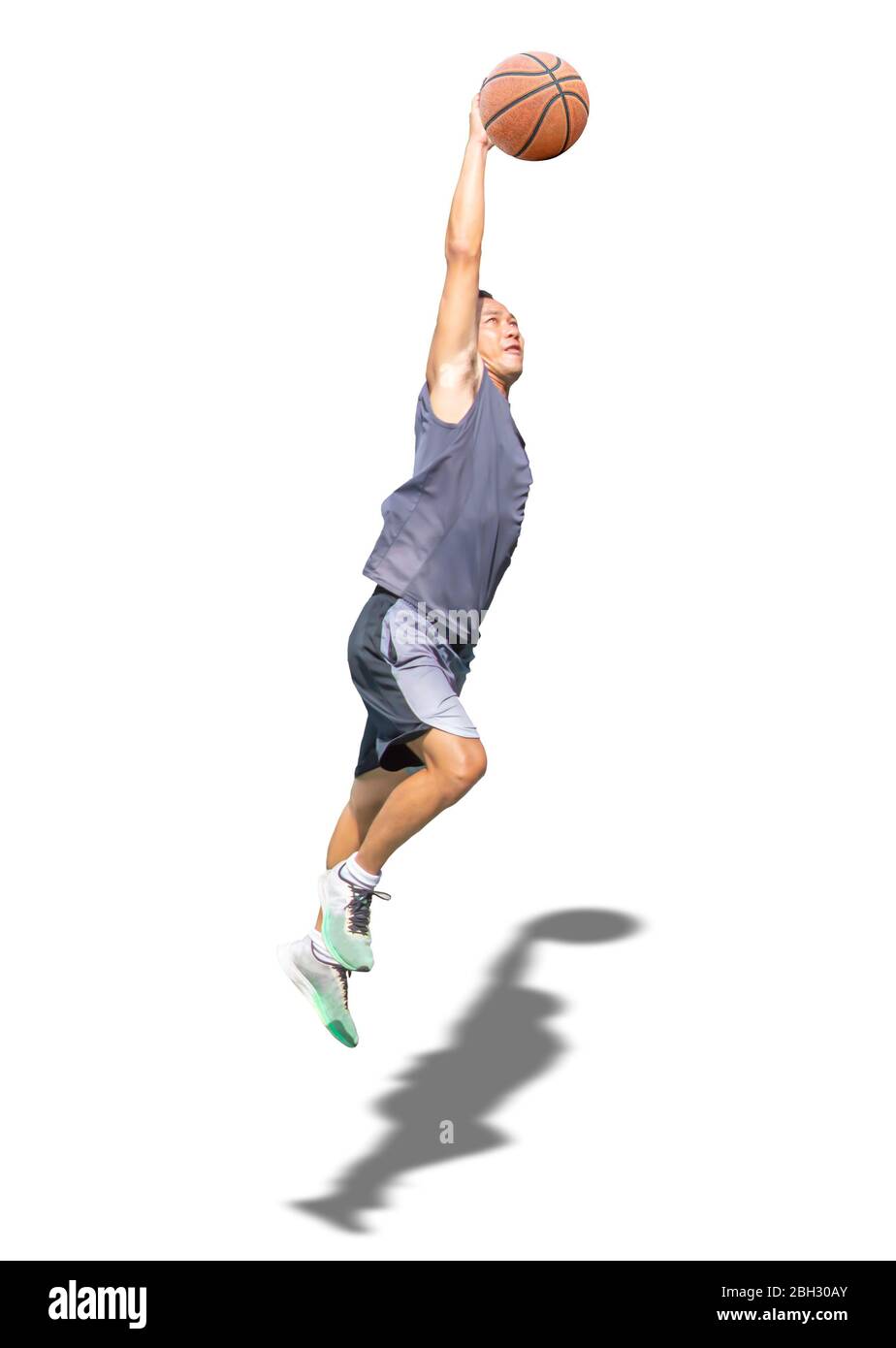 Isolated Basketball in hand man jumping on a white background with ...
