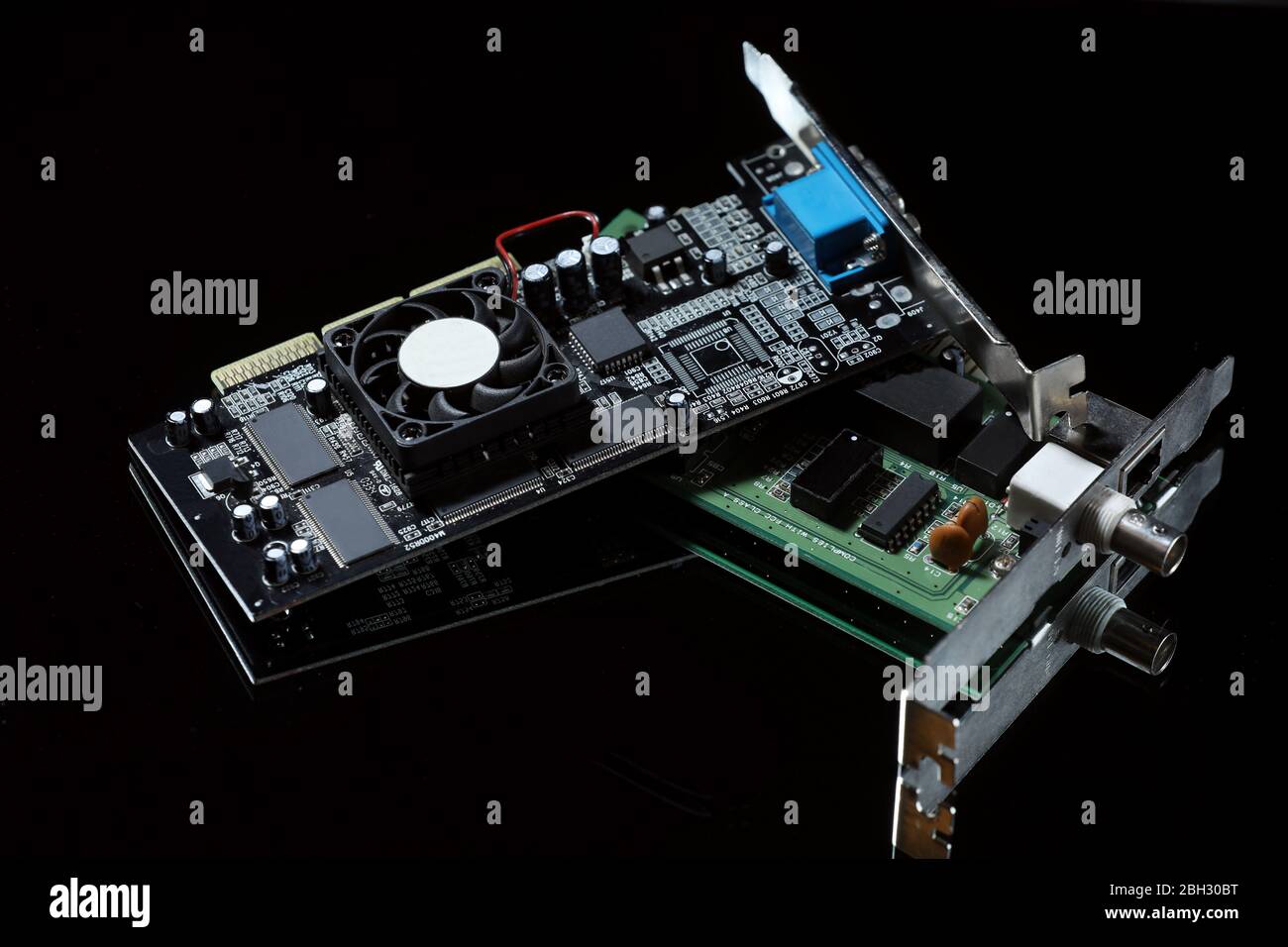 computer chip and old video card isolated on a black background Stock ...