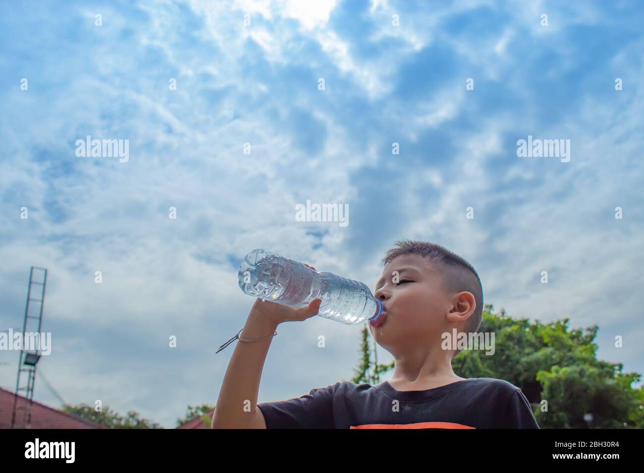 The boys are drinking cold water Stock Photo - Alamy