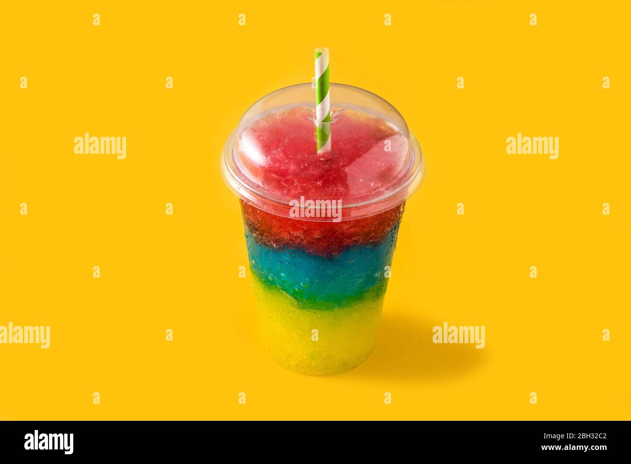 Colorful slushie of differents flavors on yellow background Stock Photo ...