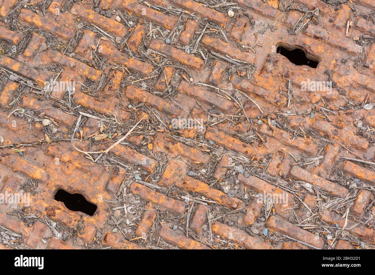 Detail of a rusting anti-slip surface of a manhole cover / inspection ...