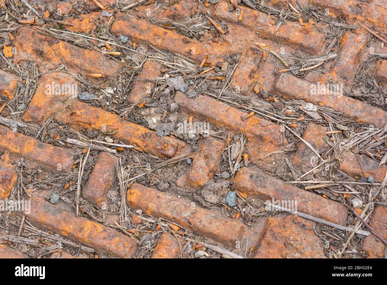 Detail of a rusting anti-slip surface of a manhole cover / inspection ...