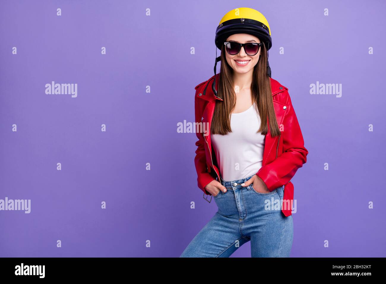 Portrait of positive cheerful girl biker enjoy motor sport riding put ...