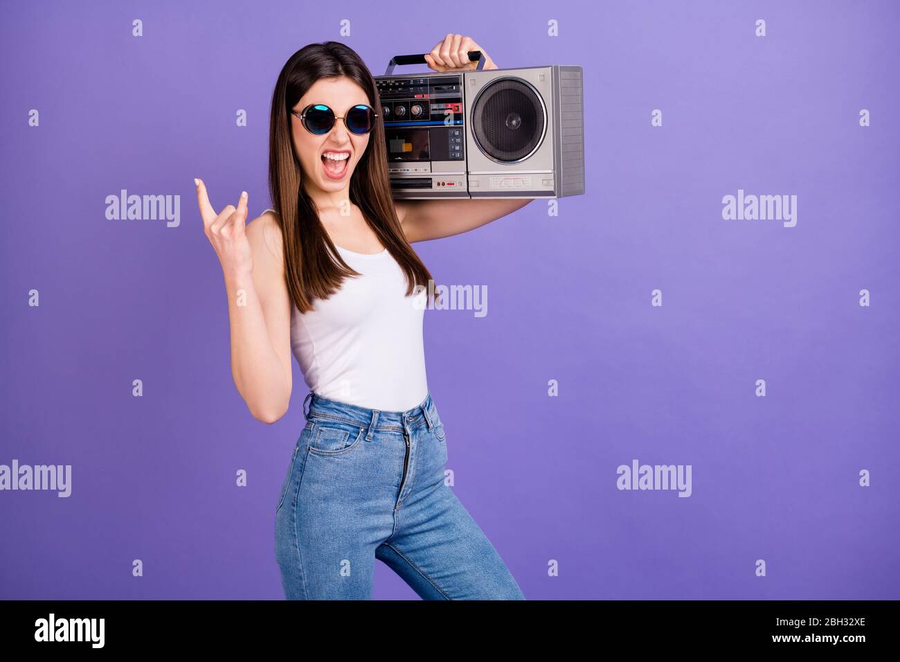 Photo of attractive crazy behavior lady hold retro recorder on shoulder ...