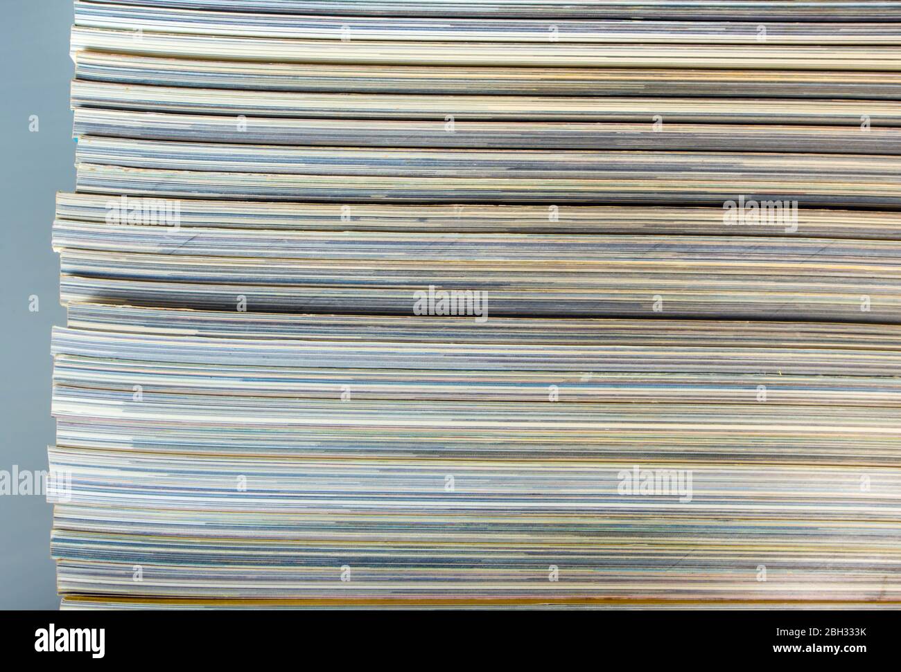 Texture of the opposite of spine of magazine pile Stock Photo - Alamy