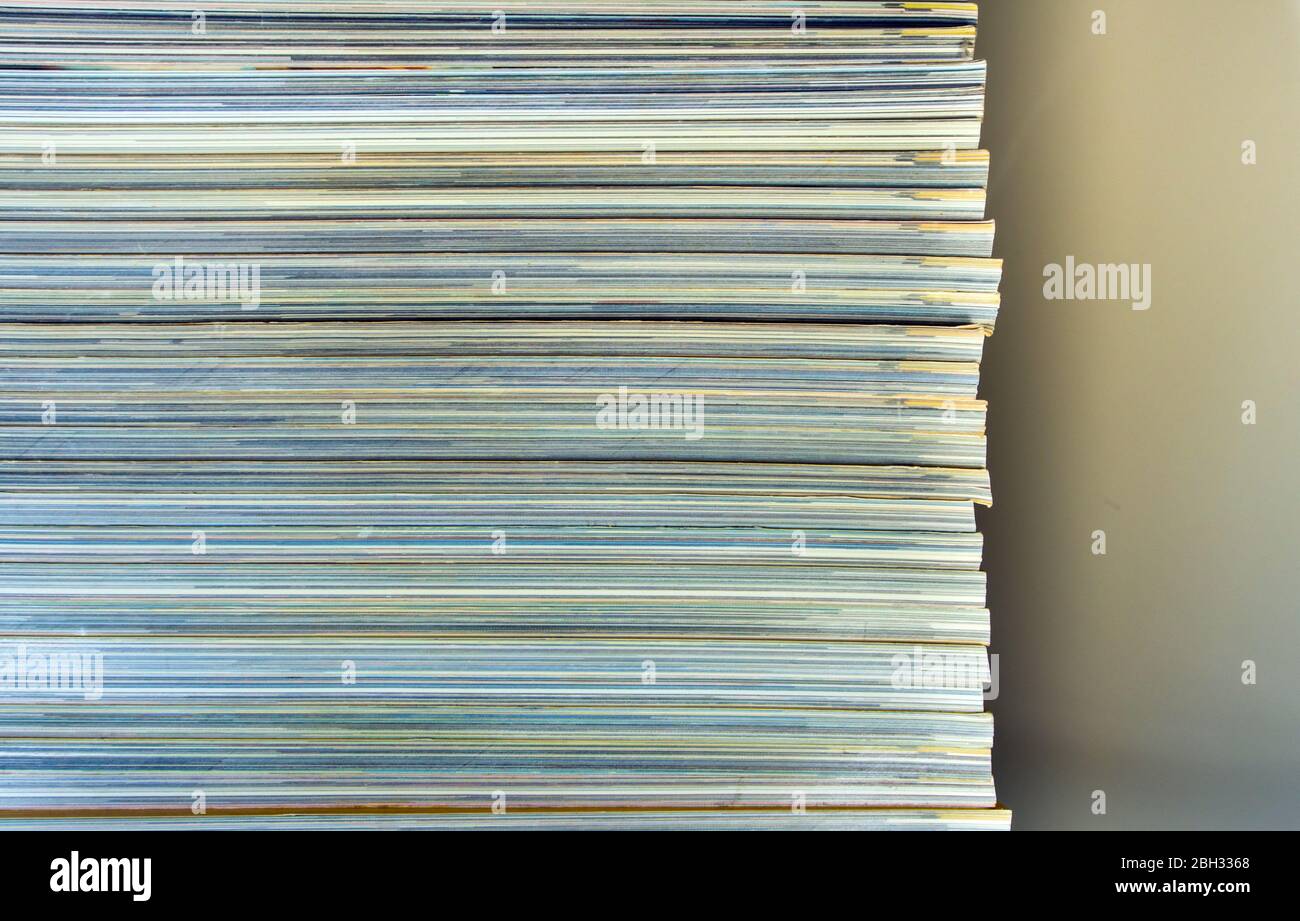 Texture of the opposite of spine of magazine pile Stock Photo - Alamy