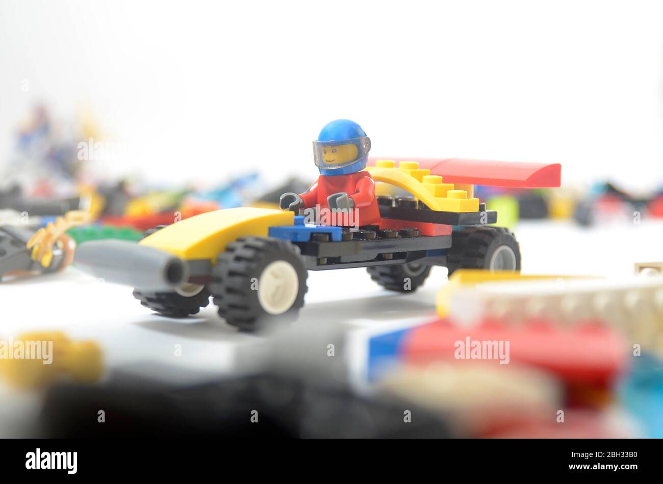 kid playing creative create car from blok, lego with mini figure Stock ...