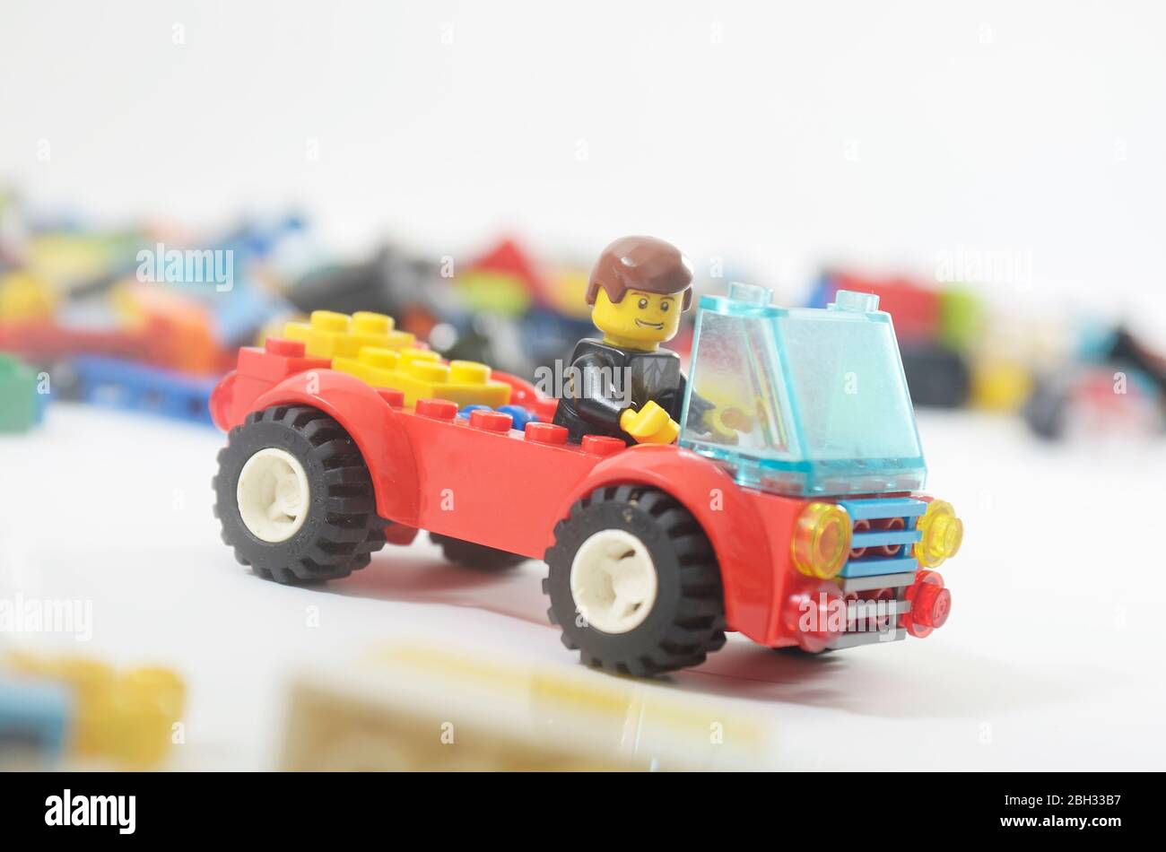 kid playing creative create car from blok, lego with mini figure Stock ...