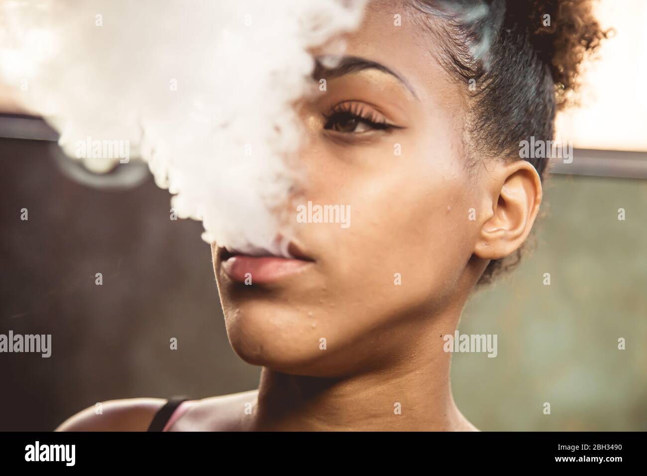 Girl Blowing Smoke Up
