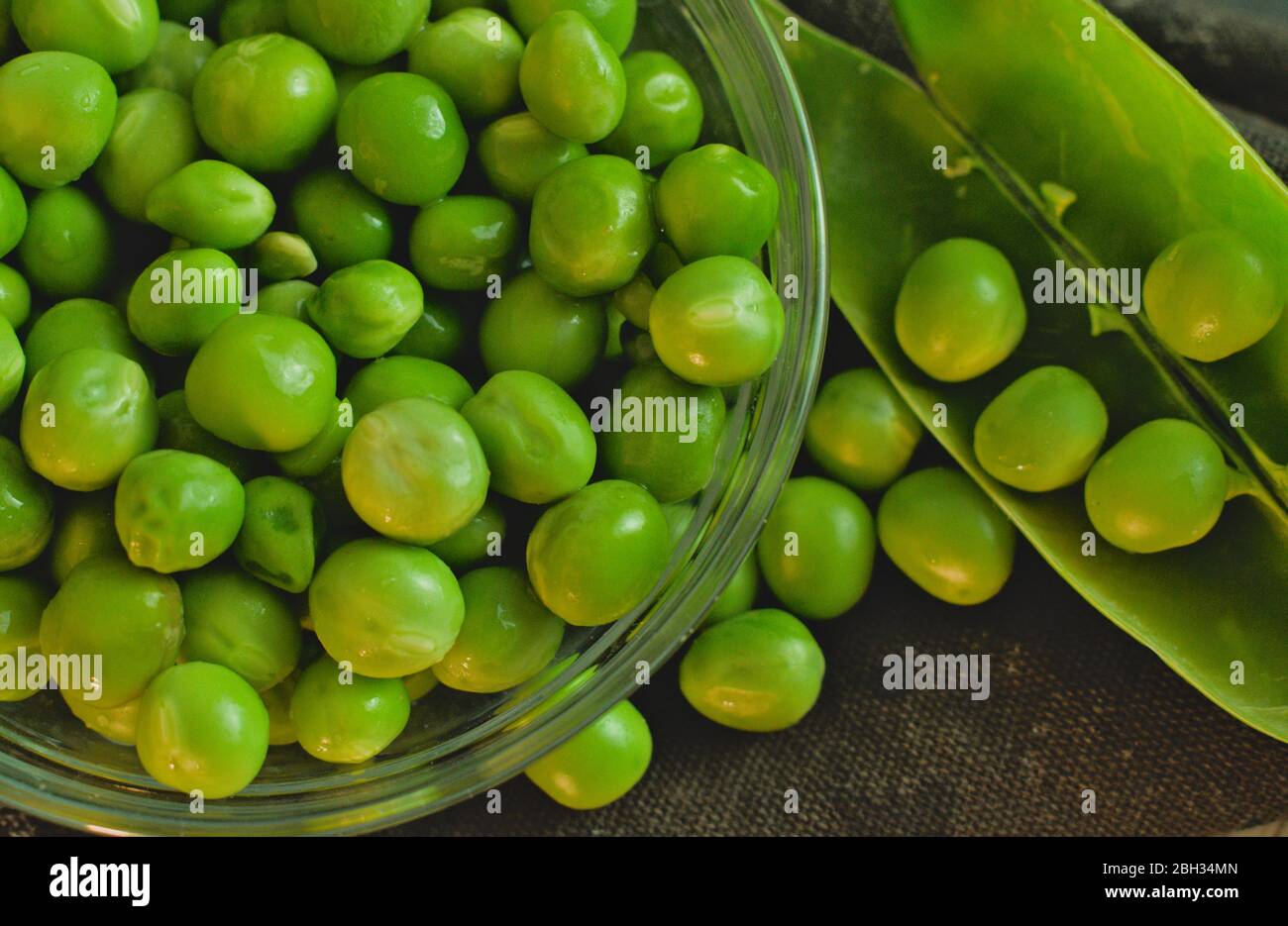 raw pea in glass container seen from above Stock Photo - Alamy