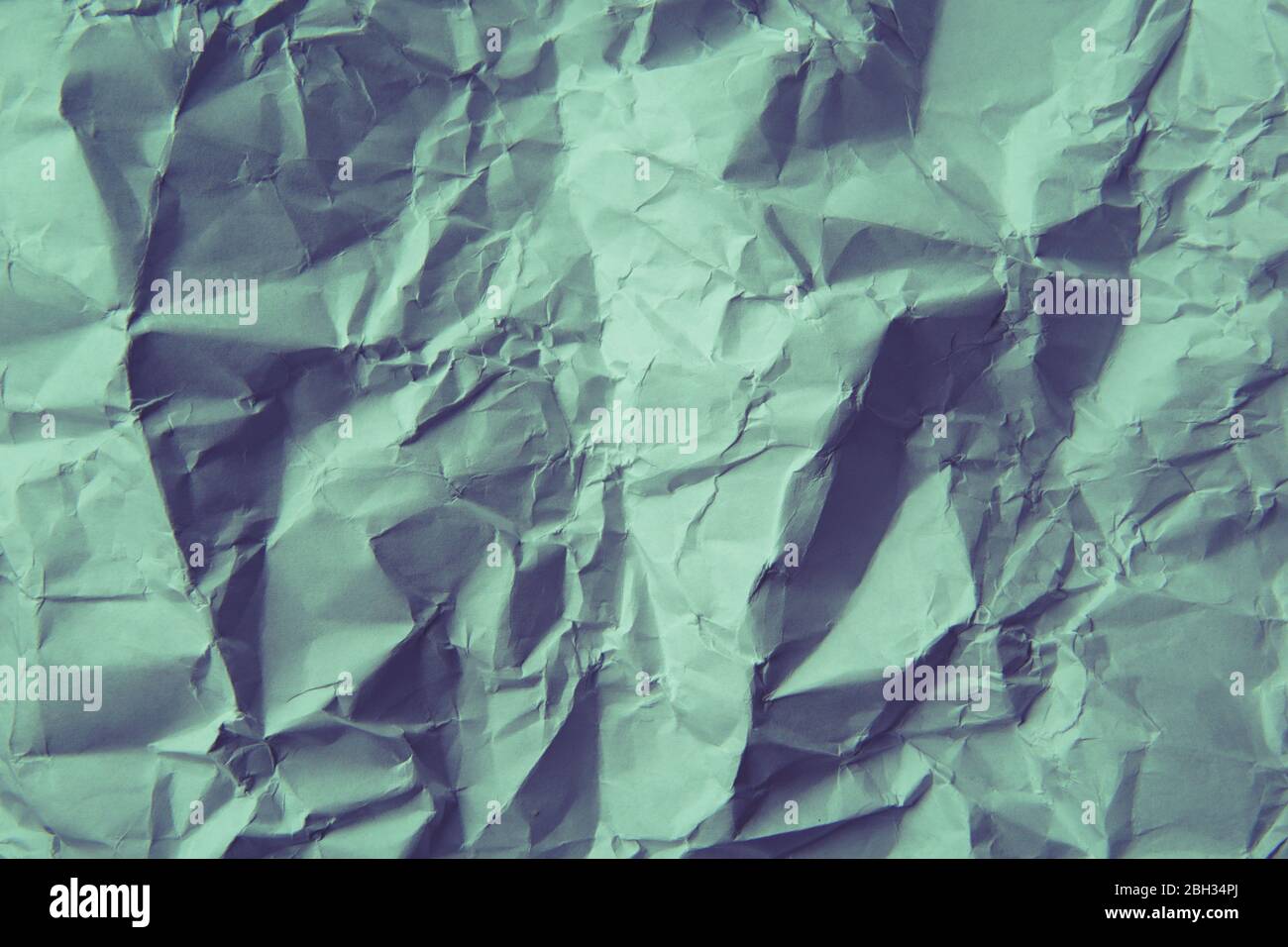 A crumpled paper background. Light green color Stock Photo - Alamy