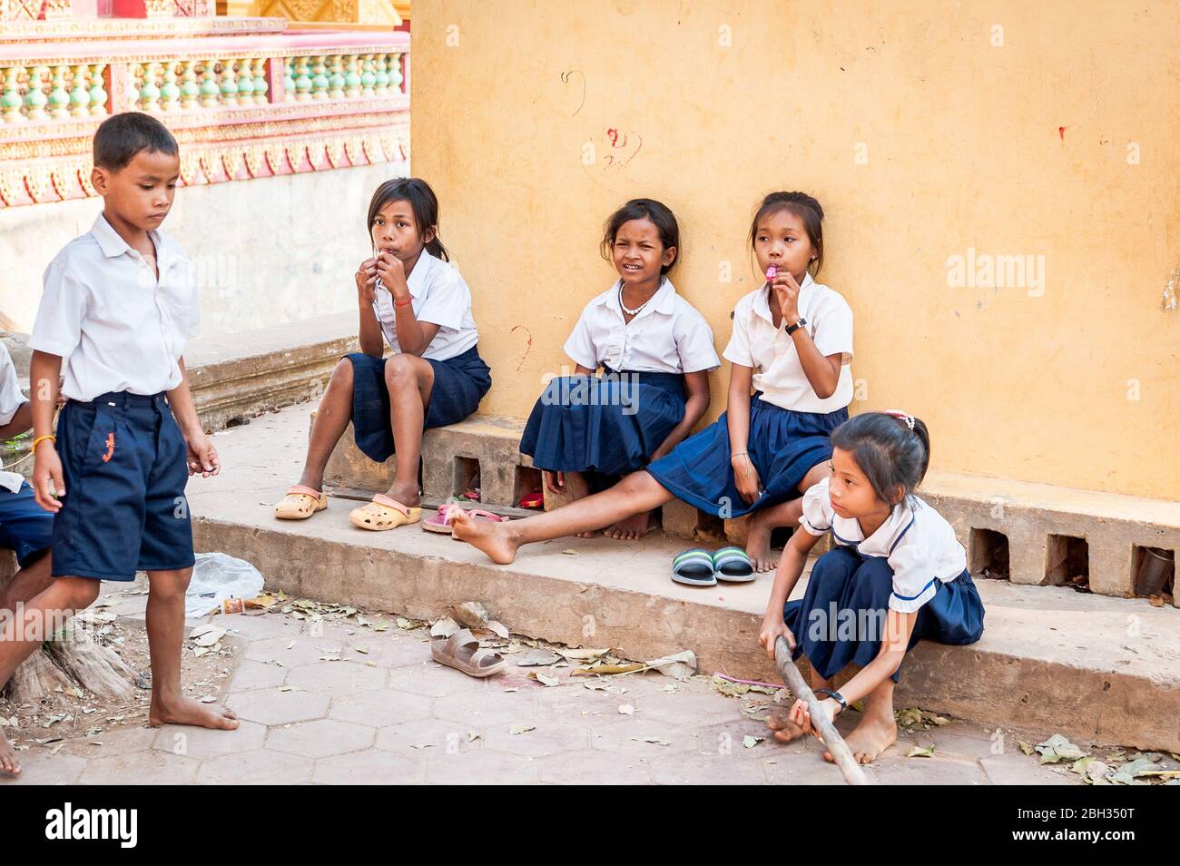 Cambodian school children play outside their local school at the ...