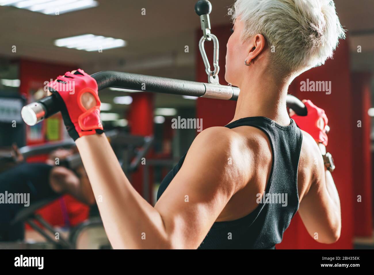 beautiful muscular fit woman exercising building muscles Stock Photo ...