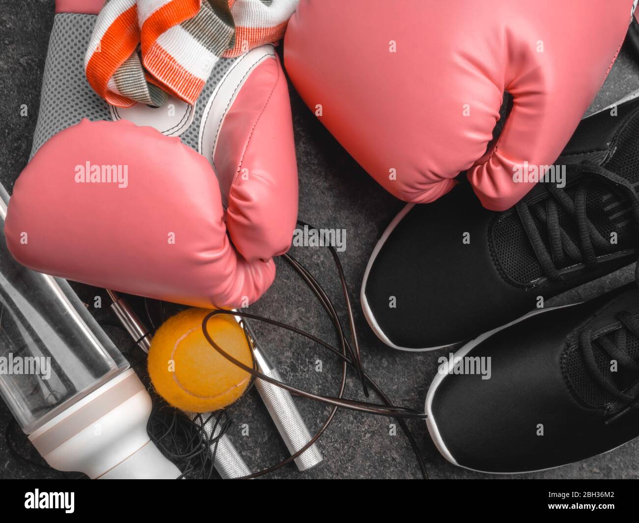 sport sneakers, leather boxing gloves, jump rope, tennis ball, bottle ...