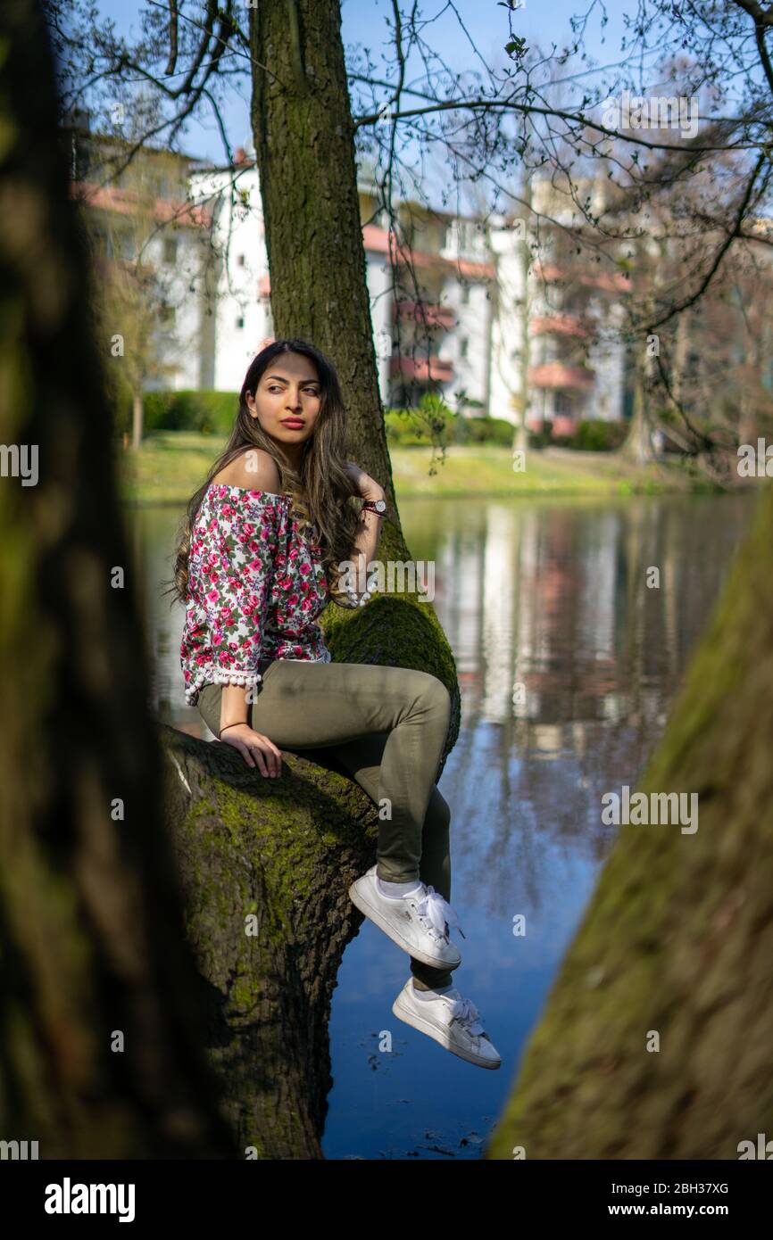 Middle east middle aged woman model posing in spring with a flowers ...