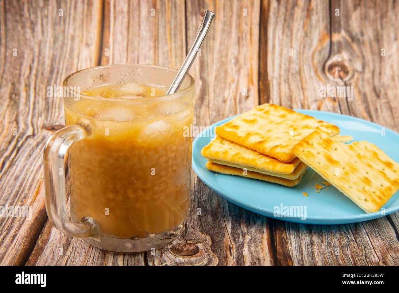 Cup of cold coffee with Crackers on a plate Stock Photo - Alamy