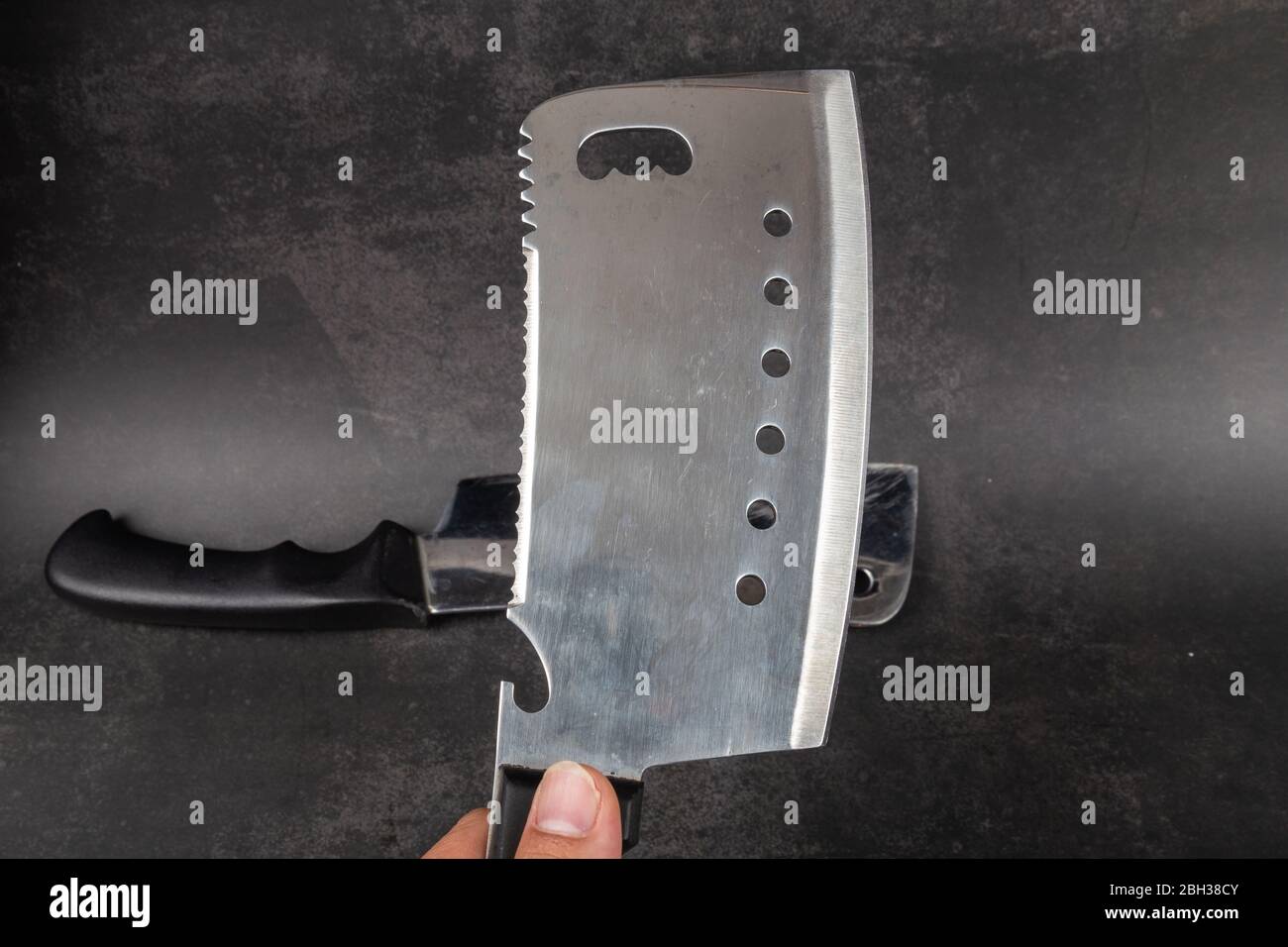 Butcher knife with wooden handle on black background Stock Photo - Alamy