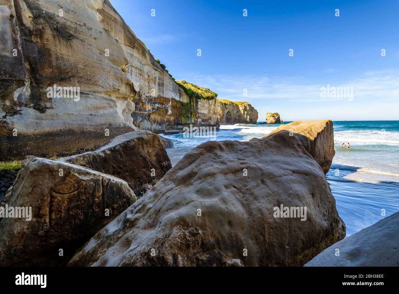 Rough coastal cliffs natural arch background hi-res stock photography ...