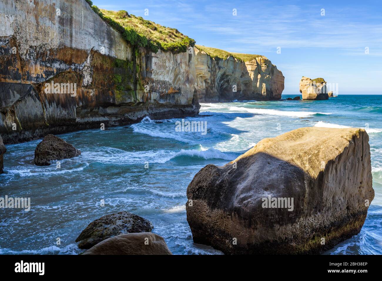 Rough coastal cliffs natural arch background hi-res stock photography ...