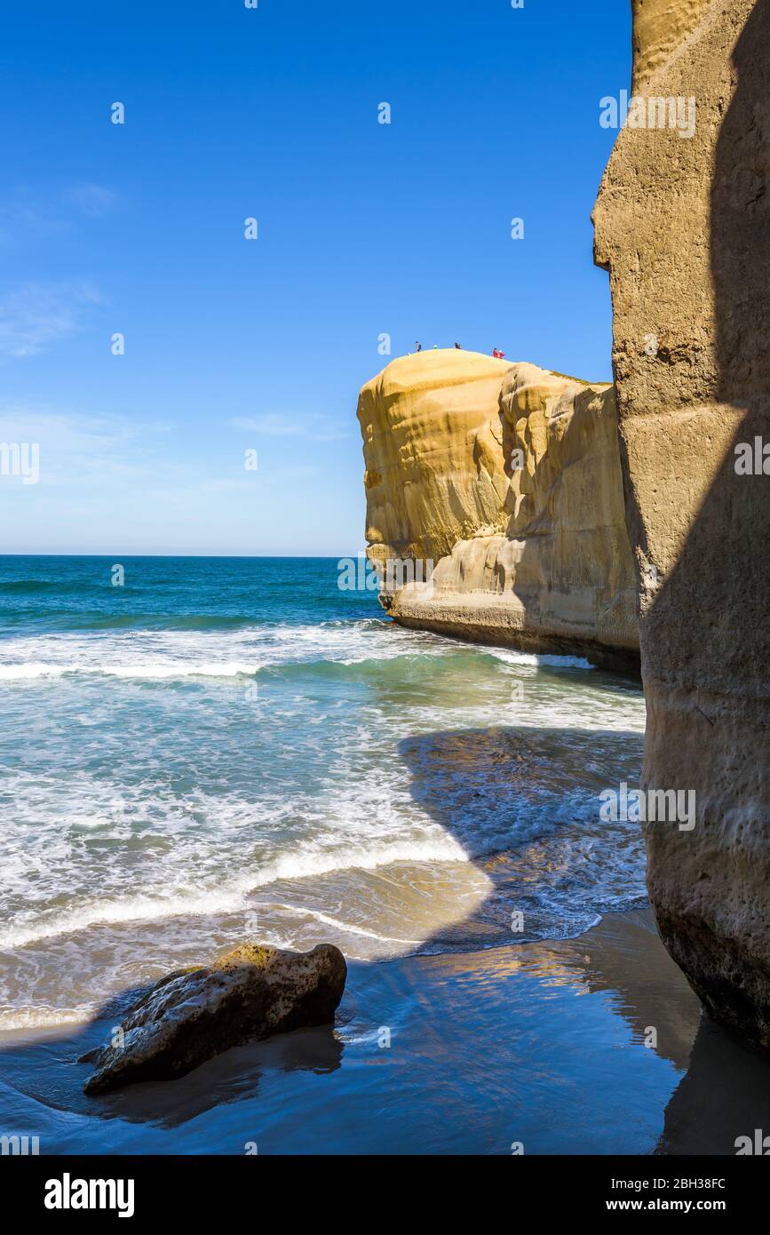 Rough coastal cliffs natural arch background hi-res stock photography ...