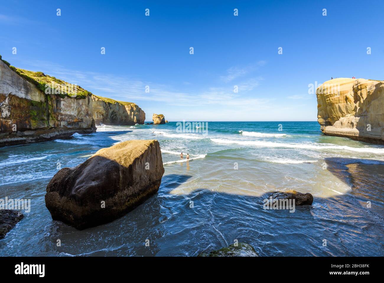 Rough coastal cliffs natural arch background hi-res stock photography ...