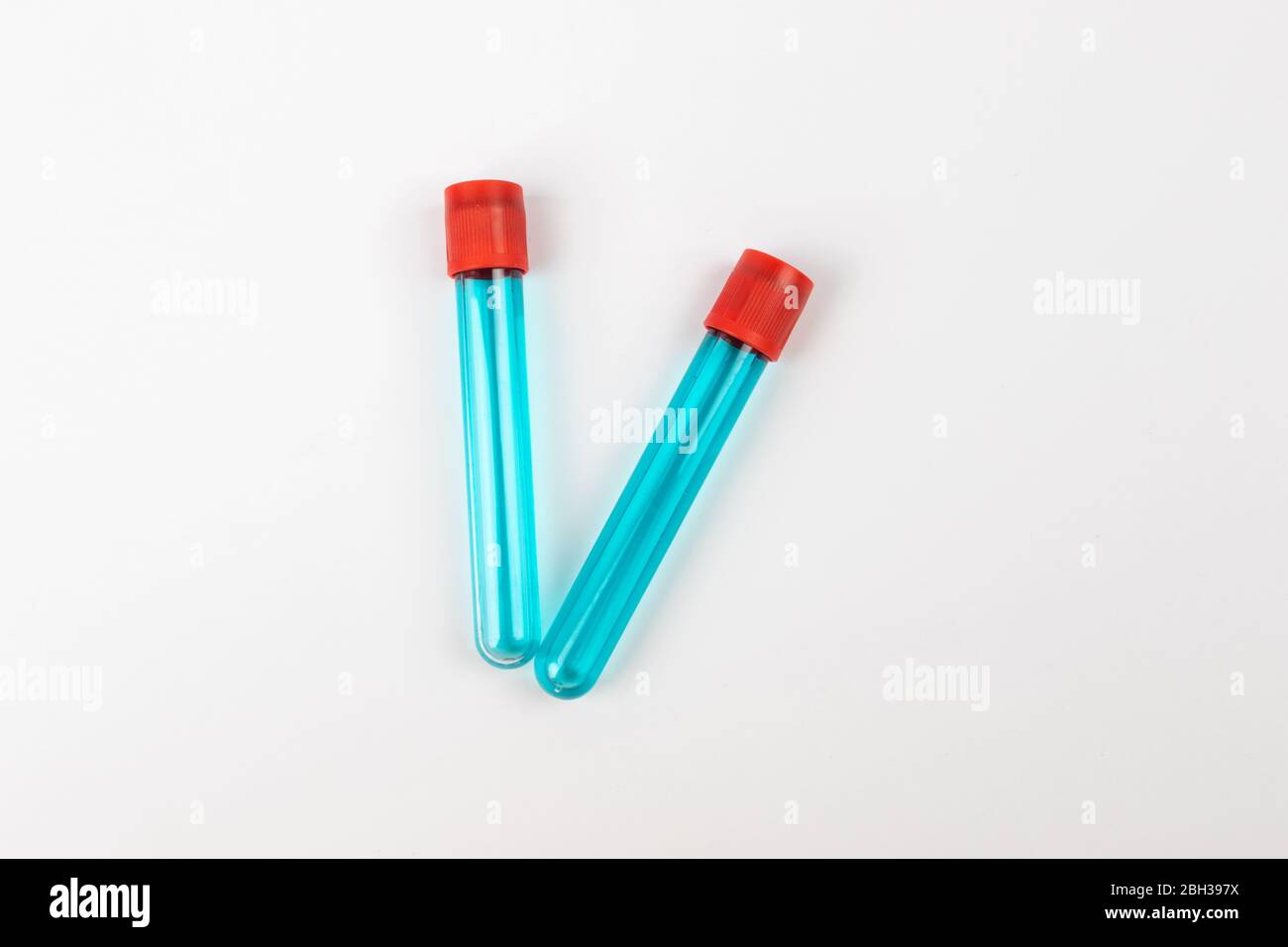 Medical test tube with blue liquid on white background Stock Photo - Alamy