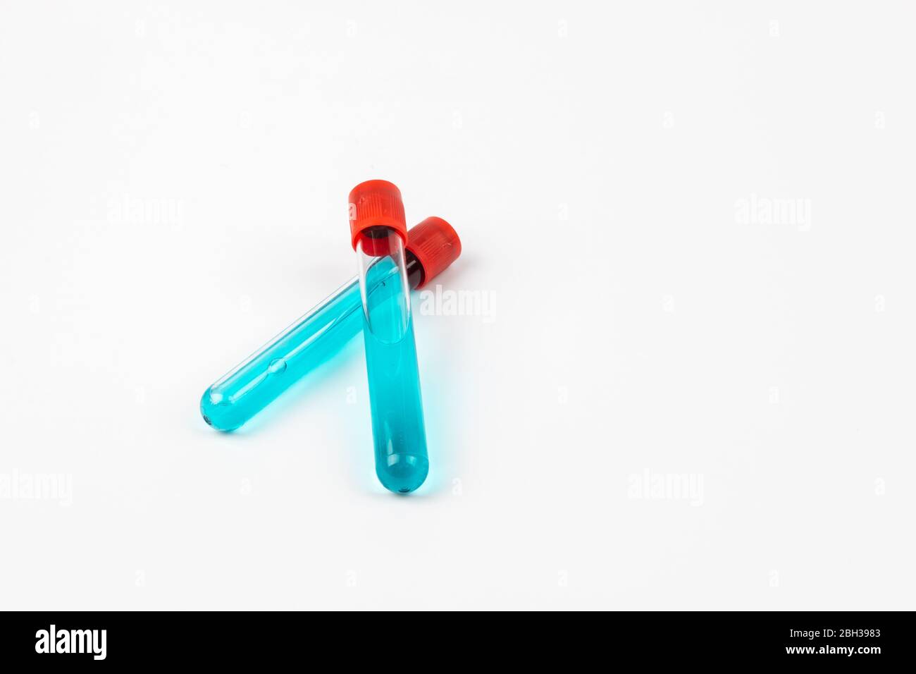 Medical test tube with blue liquid on white background Stock Photo - Alamy