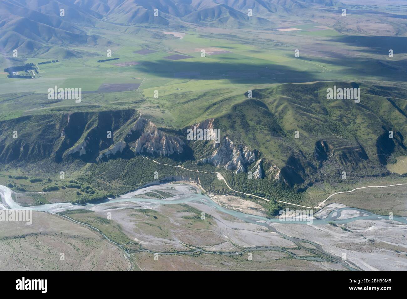 aerial, from a glider, of Clay Cliffs and Ahuriri river, shot in bright ...