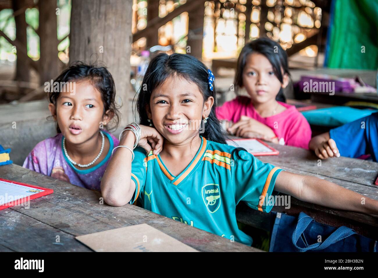Cambodian school children smile for the camera in a school in the ...