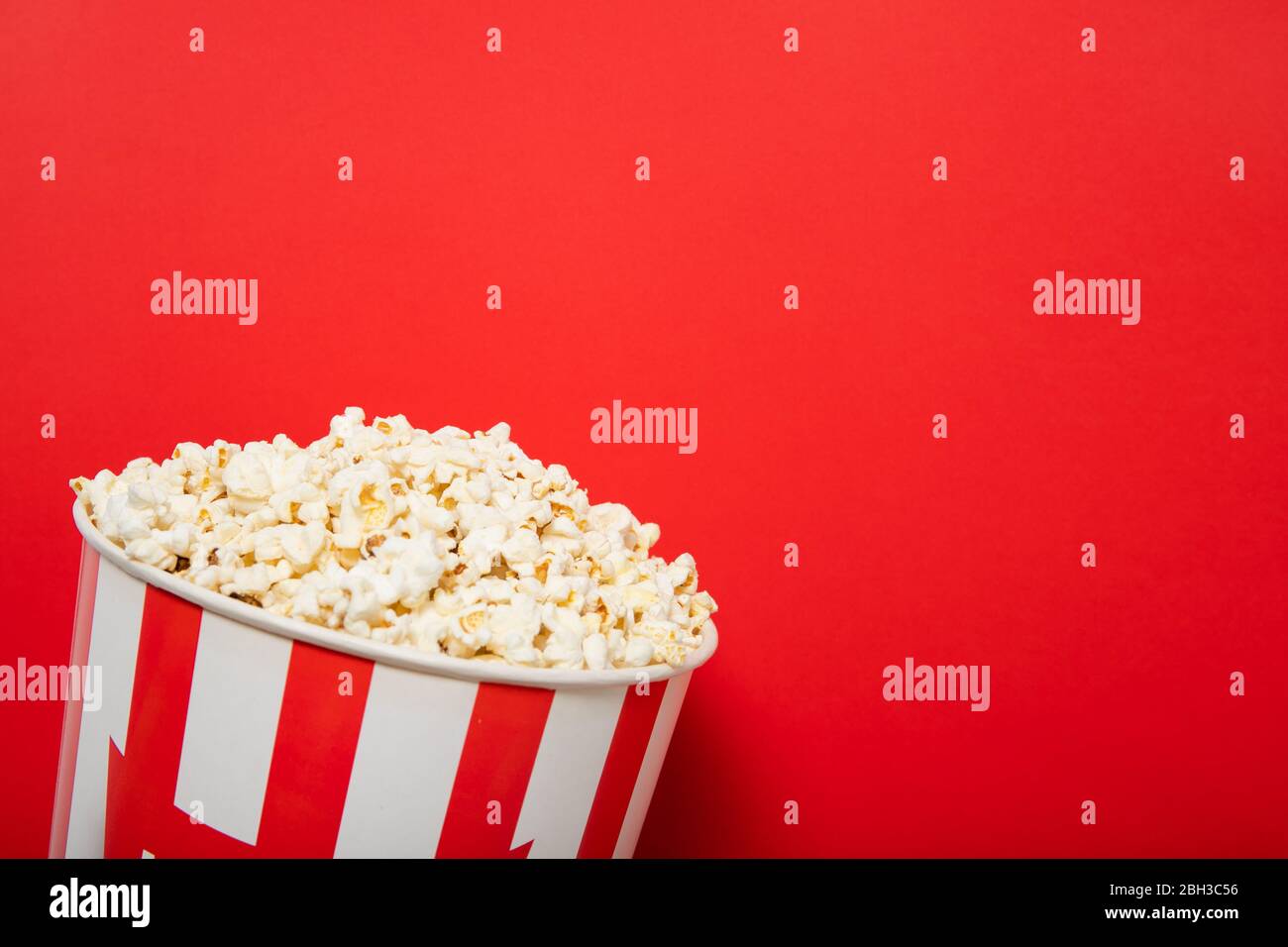 Popcorn on a red background. Place for text Stock Photo - Alamy