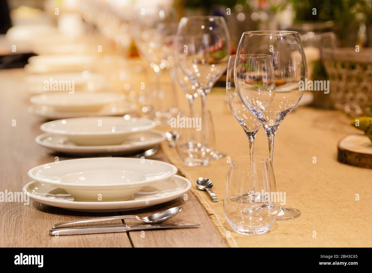 Table setting decor with cutlery, plates and glasses with kitchen ...