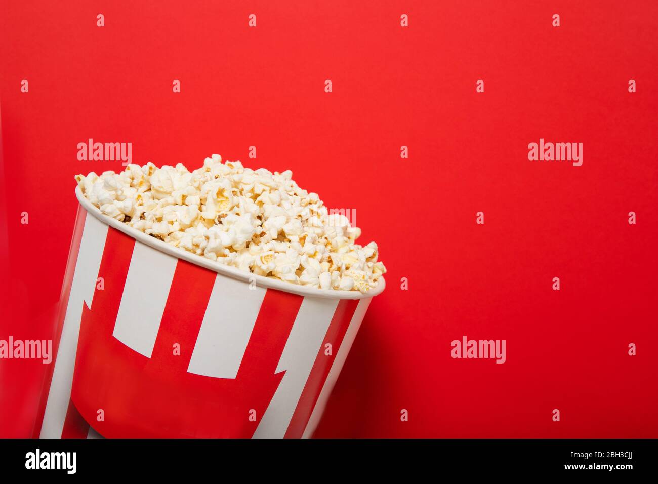 Popcorn on a red background. Place for text Stock Photo - Alamy