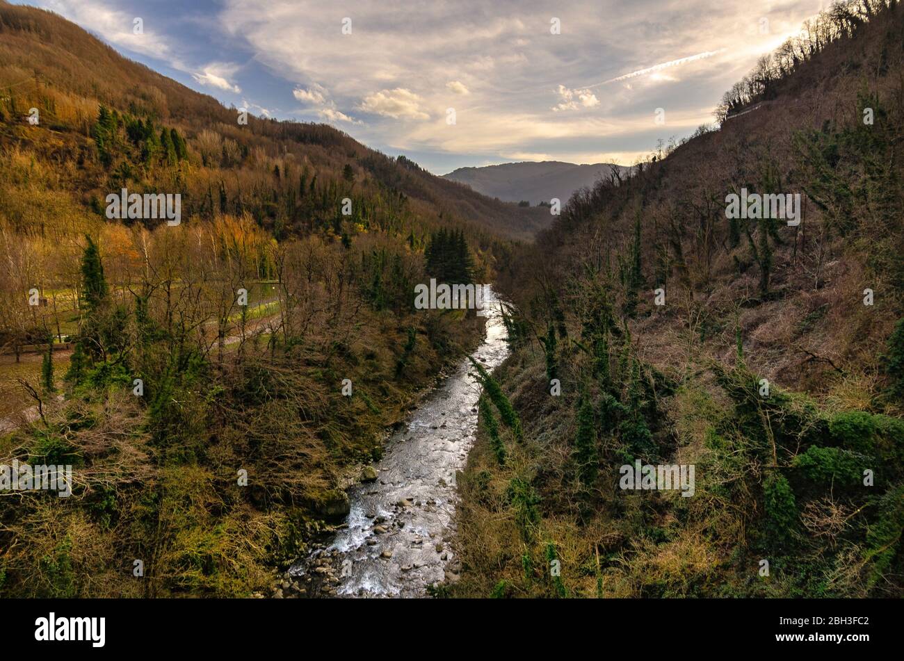 Mountain landscape with river running through it Stock Photo - Alamy