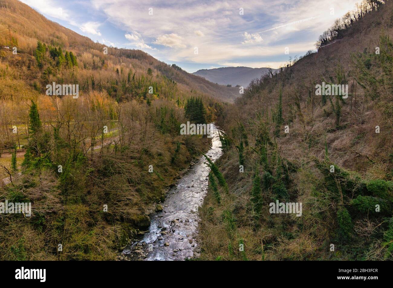 Mountain landscape with river running through it Stock Photo - Alamy