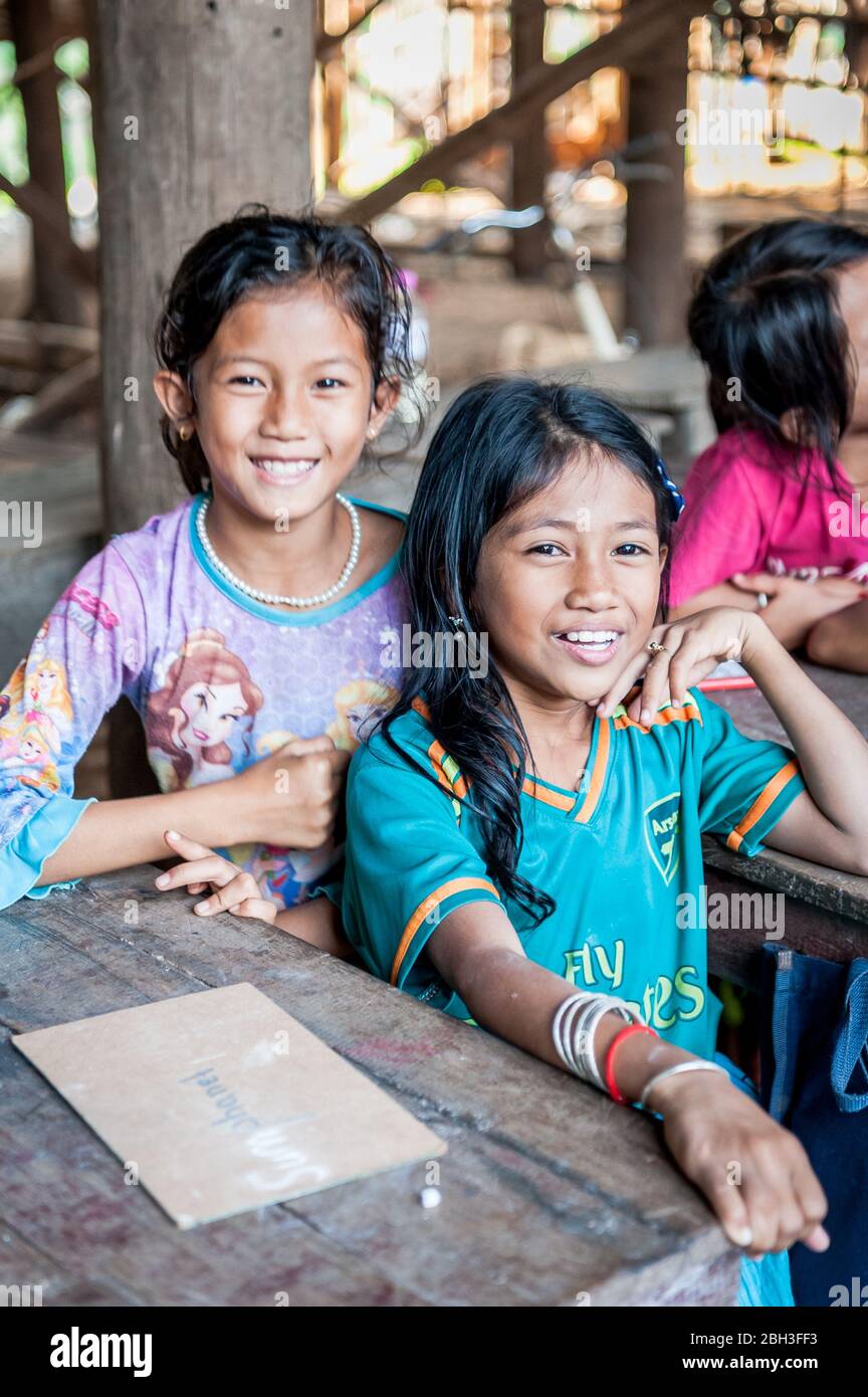 Cambodian school children smile for the camera in a school in the ...