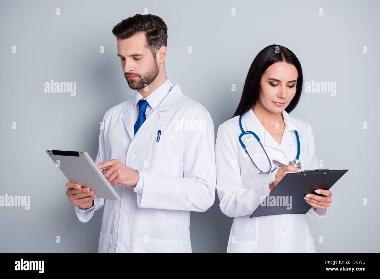 Photo of handsome busy family doc guy medic lady virology clinic ...