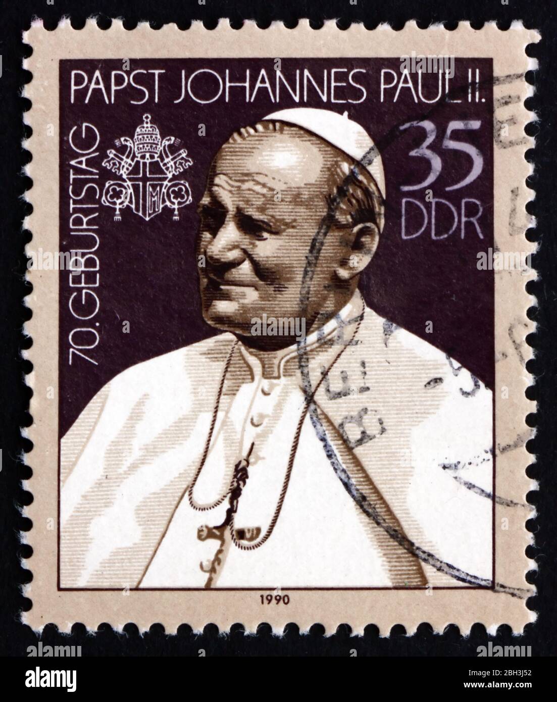 GDR - CIRCA 1990: a stamp printed in GDR shows Pope John Paul II, the ...
