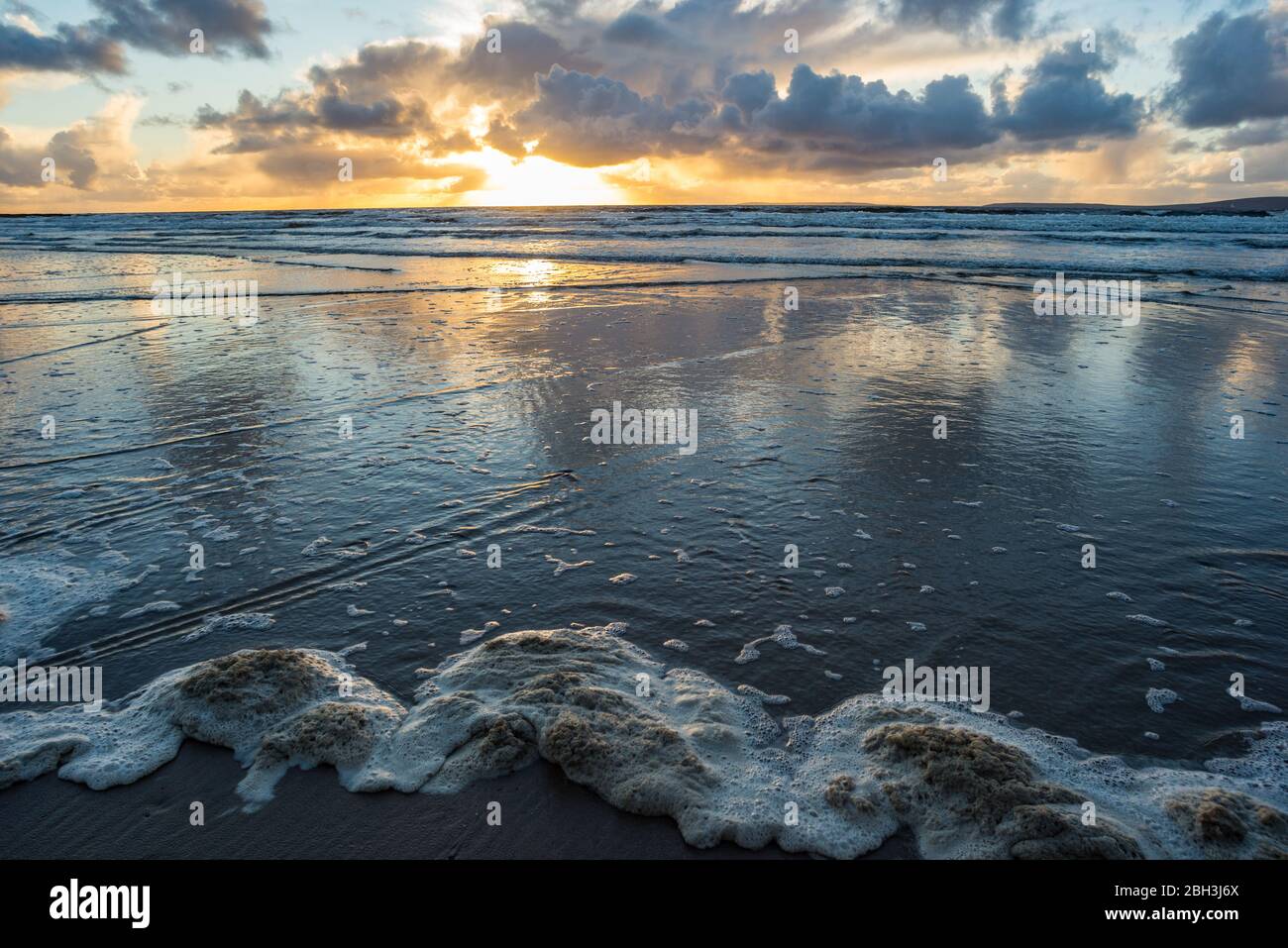 sunset sky reflection on empty beach, wild atlantic way on west coast ...
