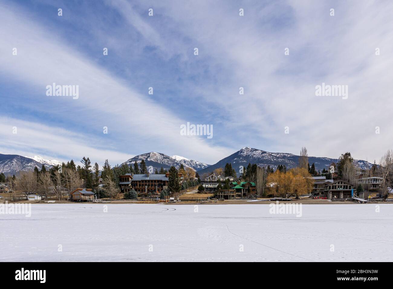 INVERMERE, CANADA - MARCH 17, 2020: frozen Windermere lake and rocky ...
