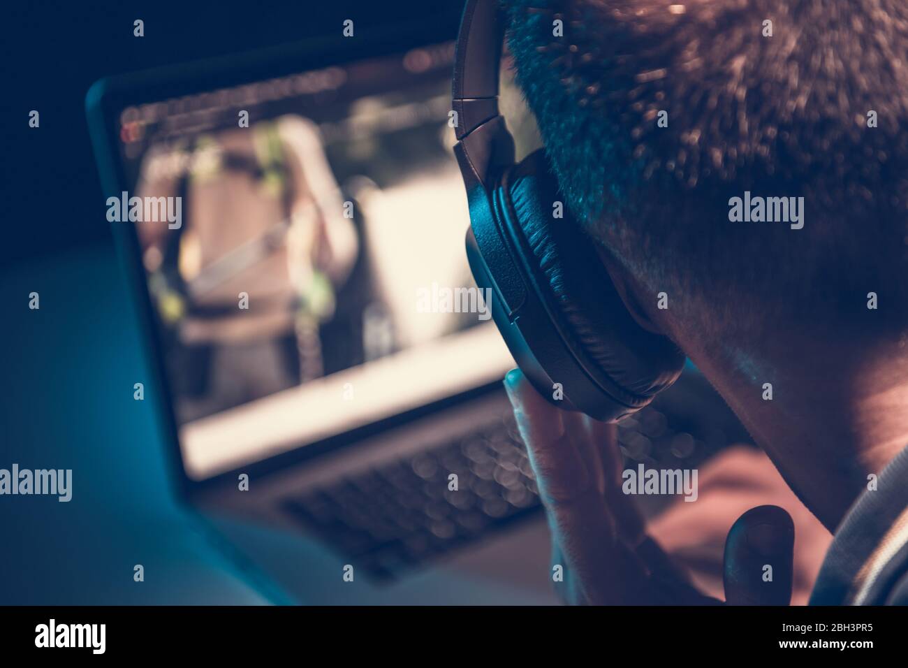 Caucasian Male Listening To Music On Laptop Computer Stock Photo - Alamy